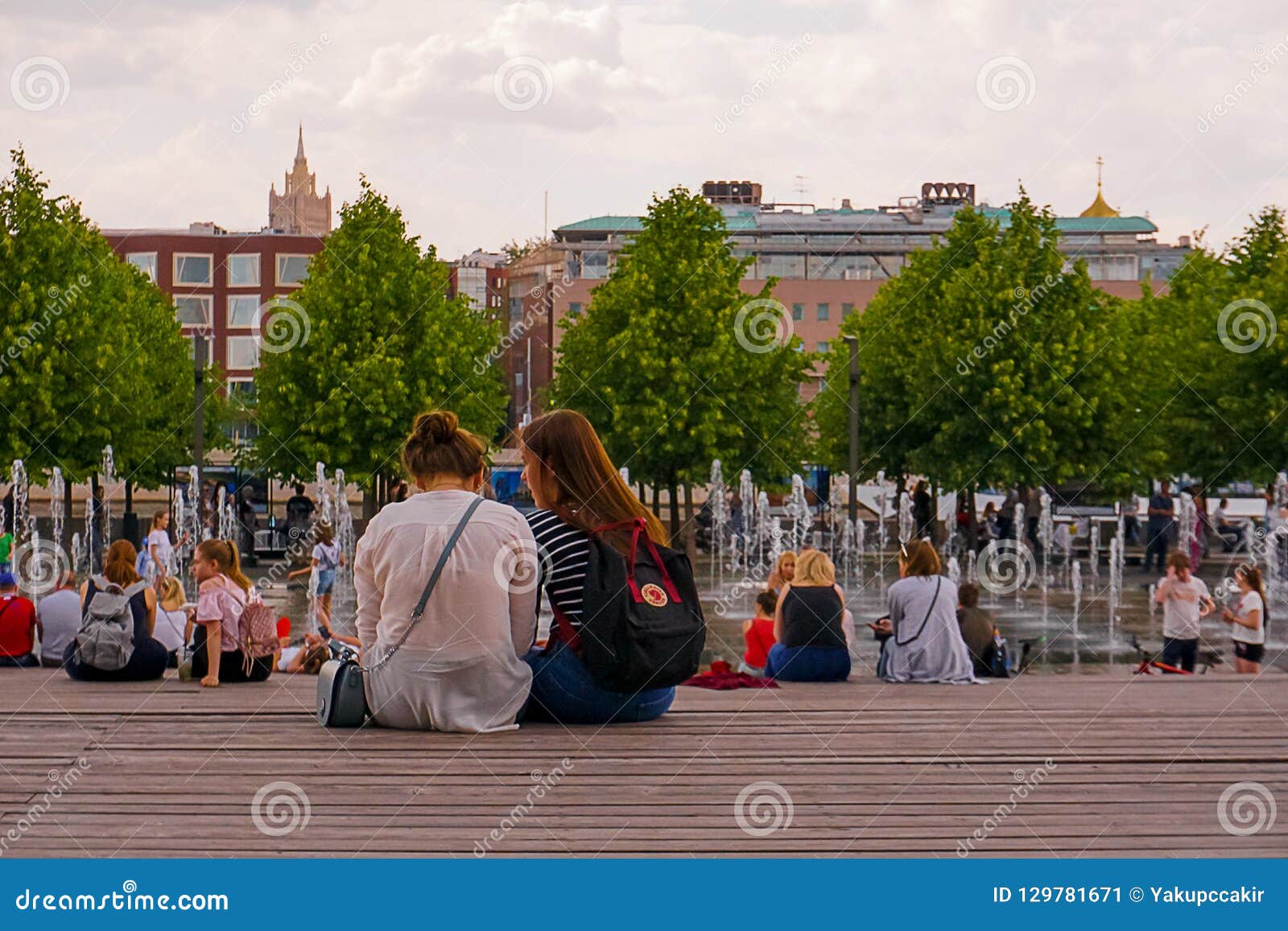 Student Girls Sitting on the Bench, Resting in the Park, Spring in ...