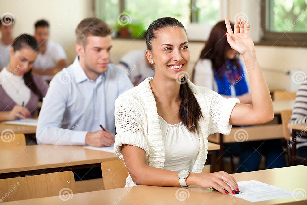 Student Giving Answer in Class with His Hand Raised Stock Image - Image ...