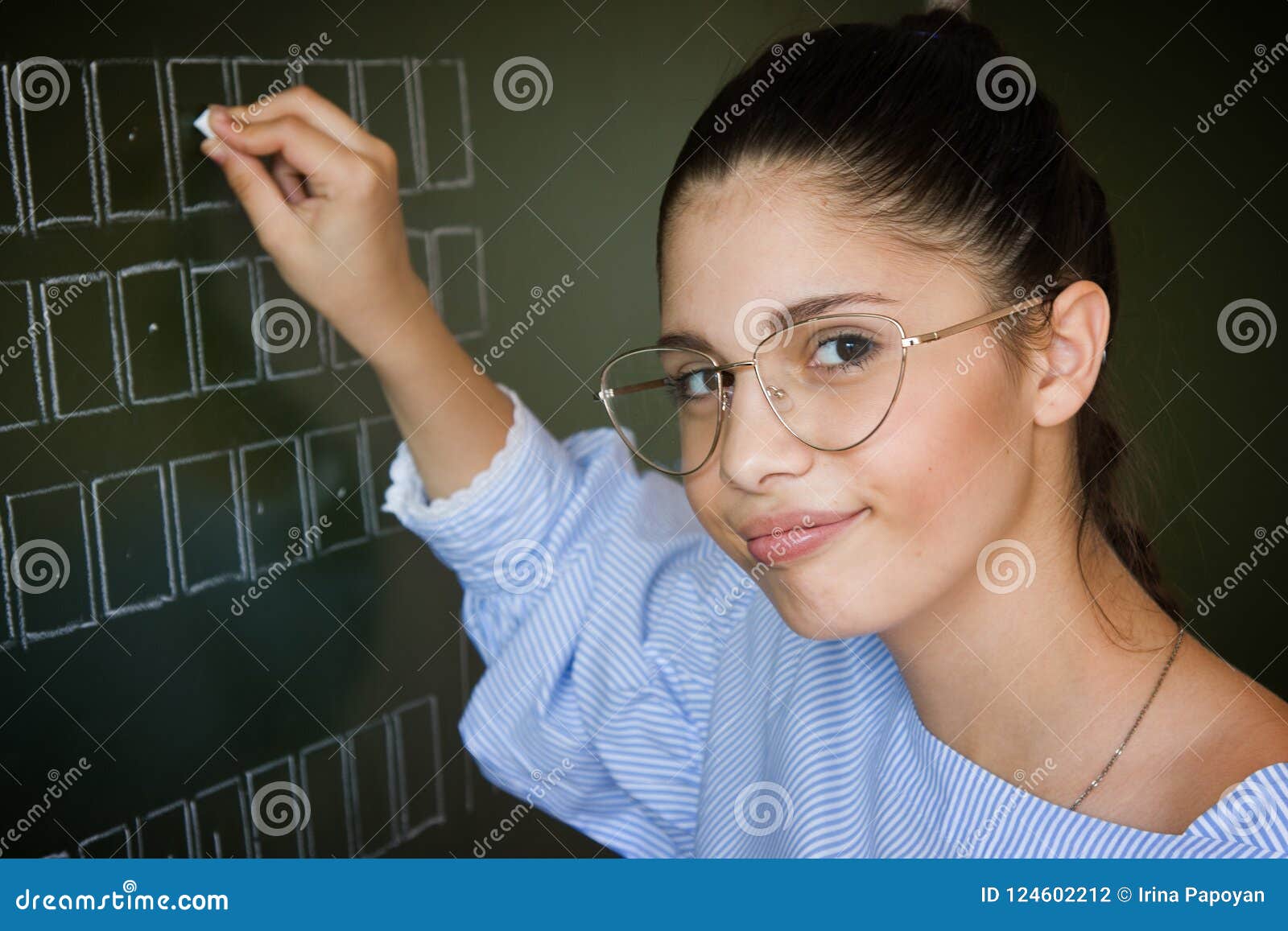Student in Glasses Writing on Blackboard with Chalk in Classroom Stock ...