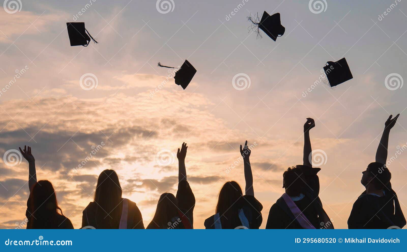Student Graduates Toss Their Caps at Sunset. Stock Photo - Image of ...