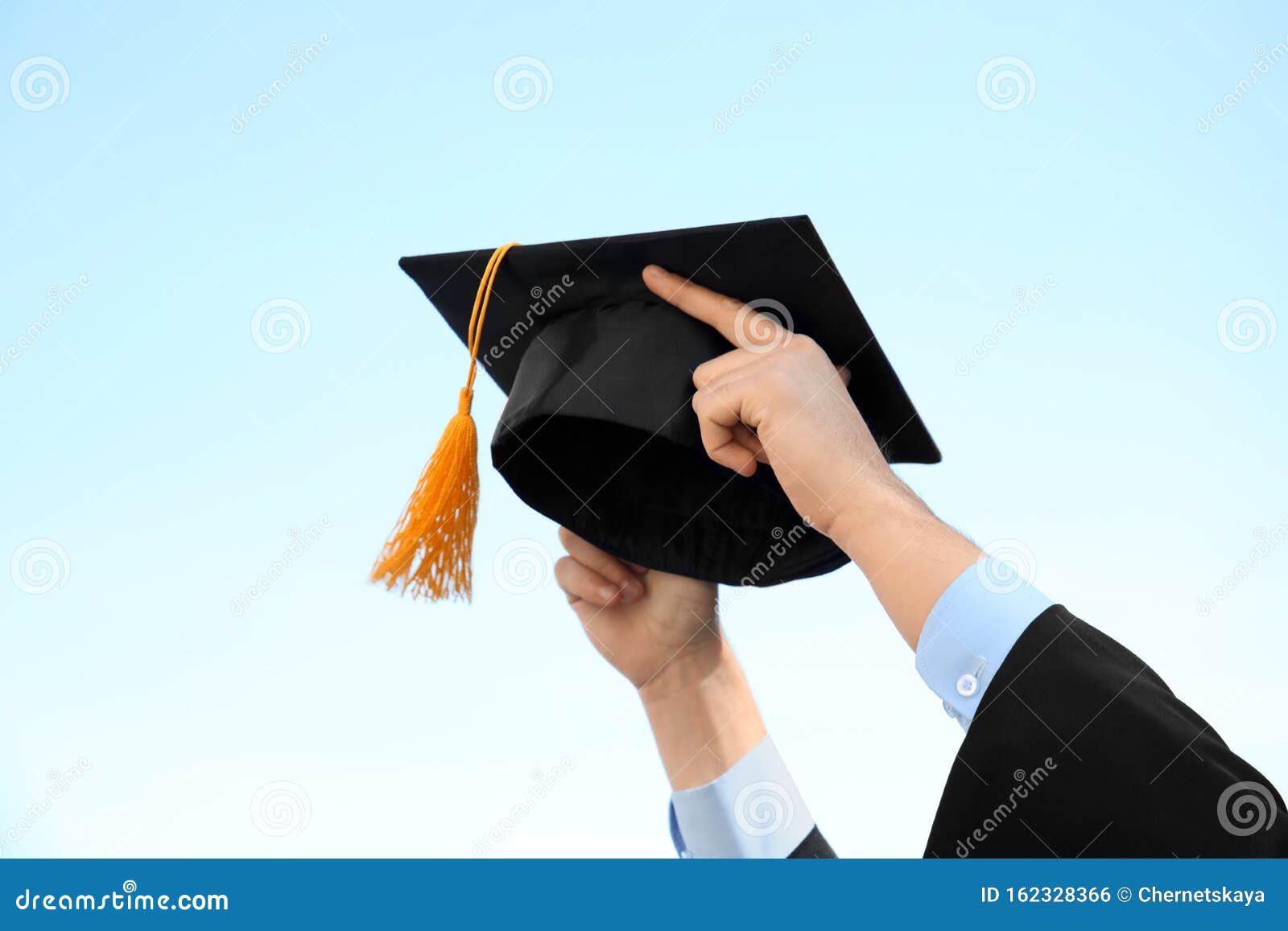Student with Graduation Hat and Blue Sky on Background Stock Photo ...