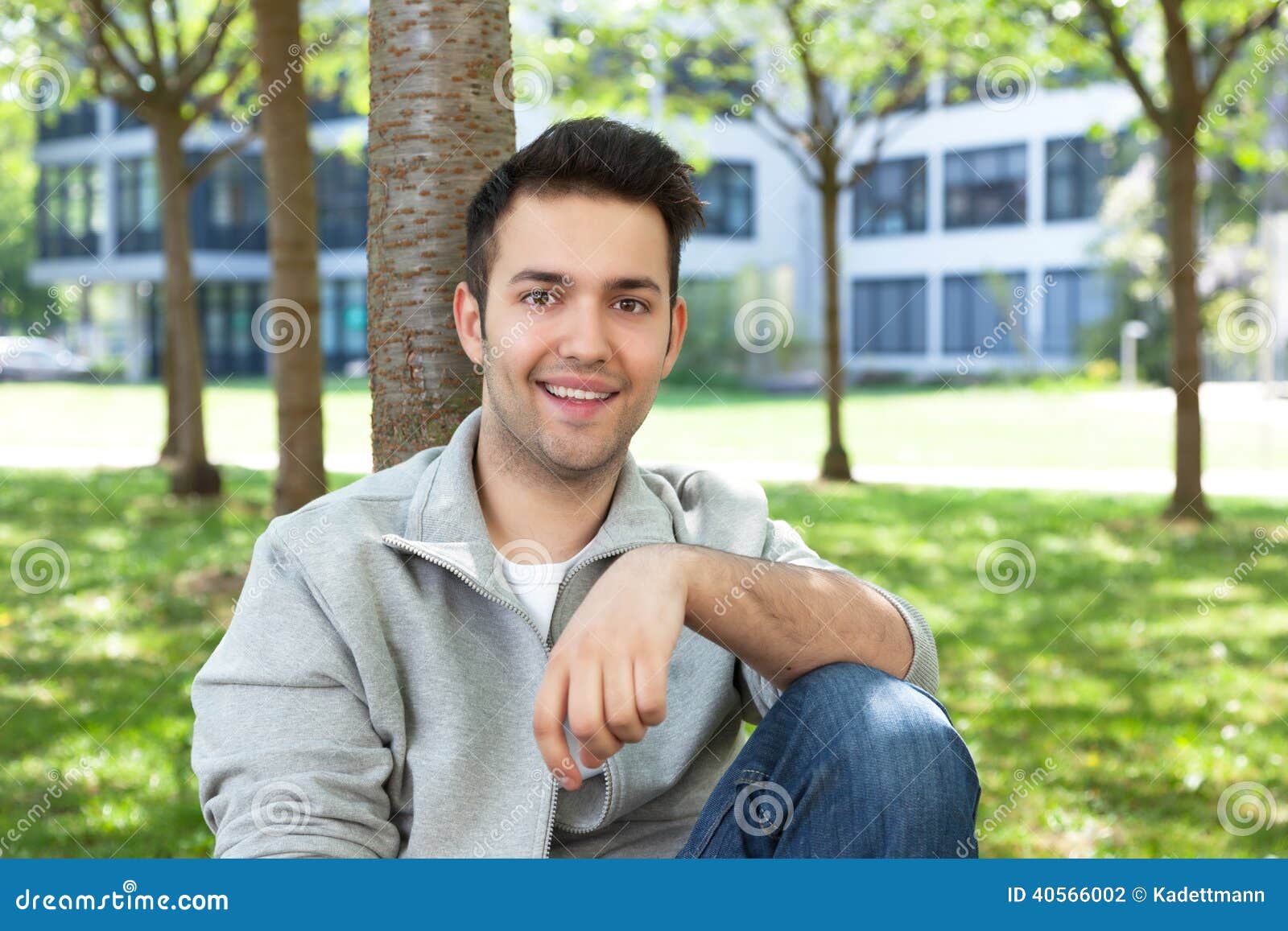 Student in a Grey Jacket Relaxing at the Campus Stock Photo - Image of ...