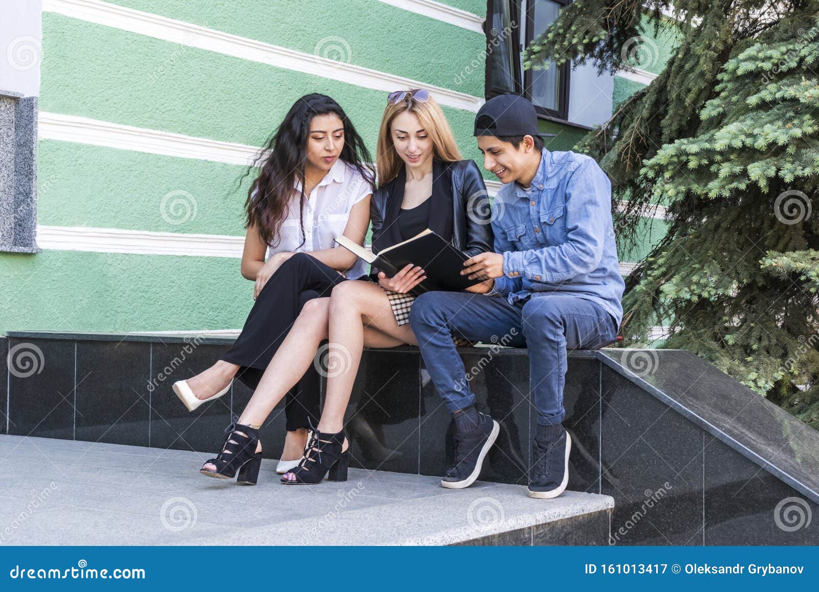 Student Group Reading a Textbook Stock Image - Image of friend ...