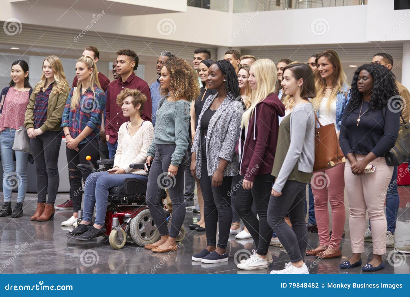 Student Group Standing in University Atrium Looking Away Stock Photo ...