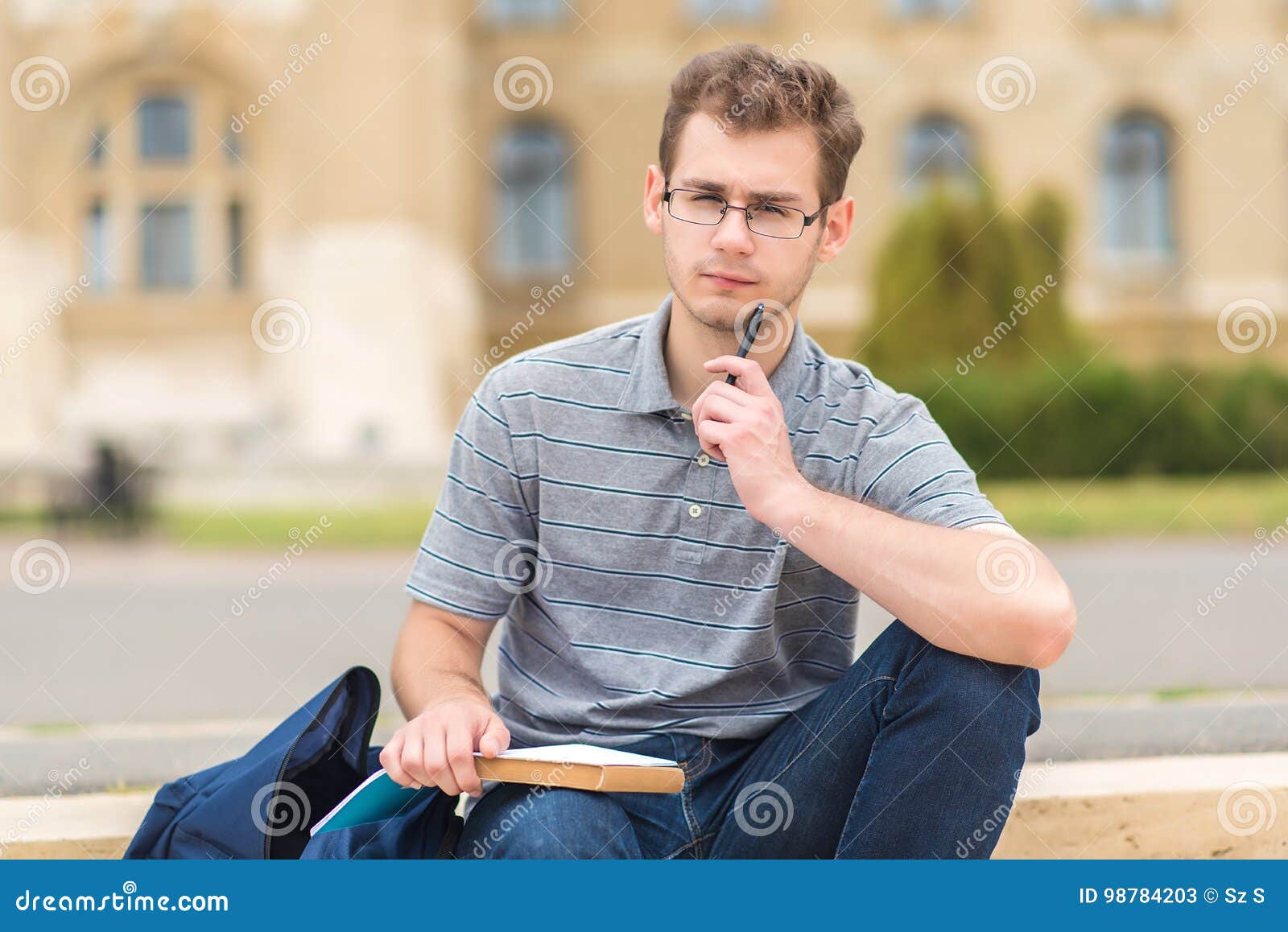 Student guy doing homework stock image. Image of page - 98784203