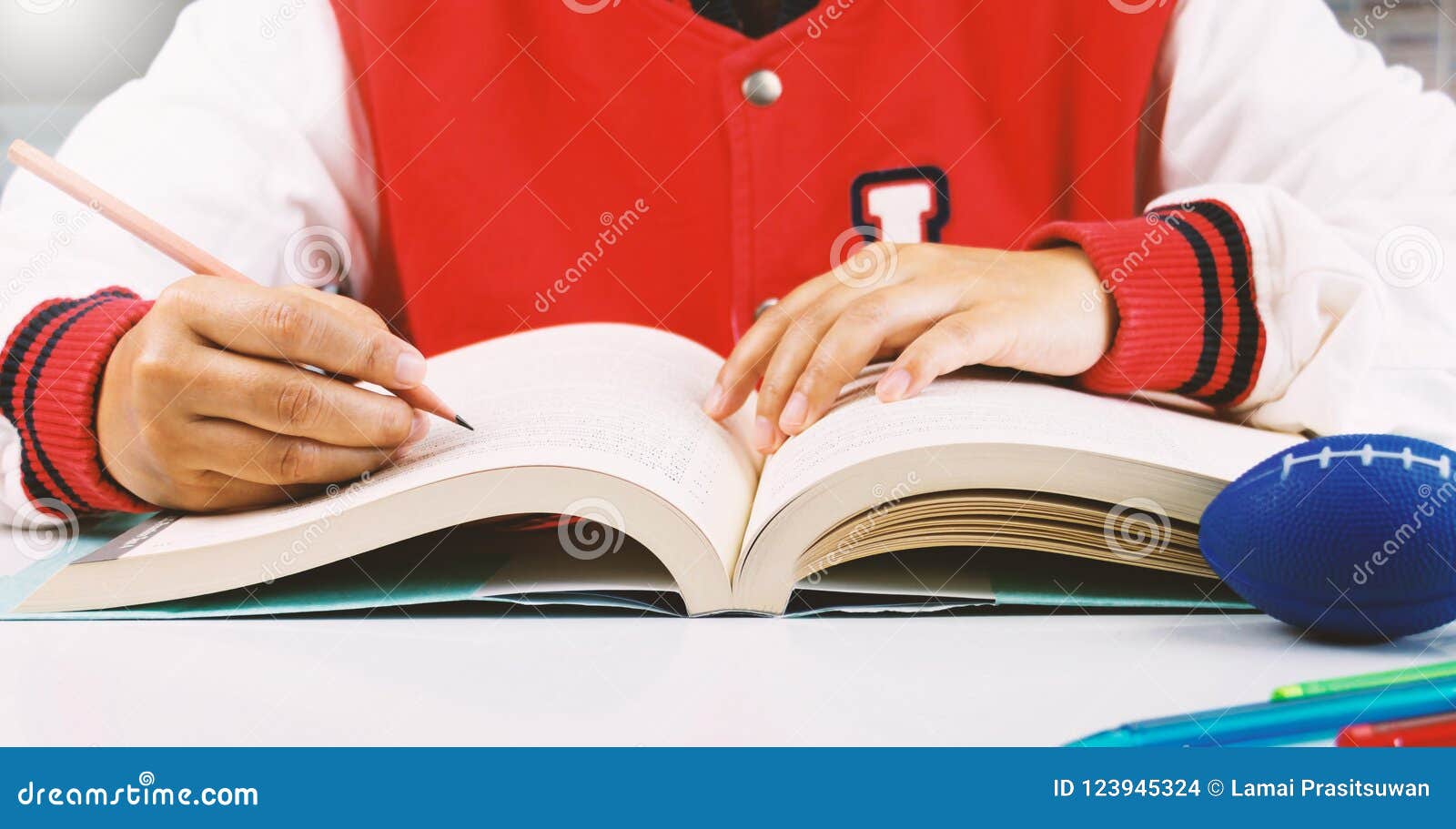 Student Writing and Reading Book Stock Photo - Image of evaluation ...