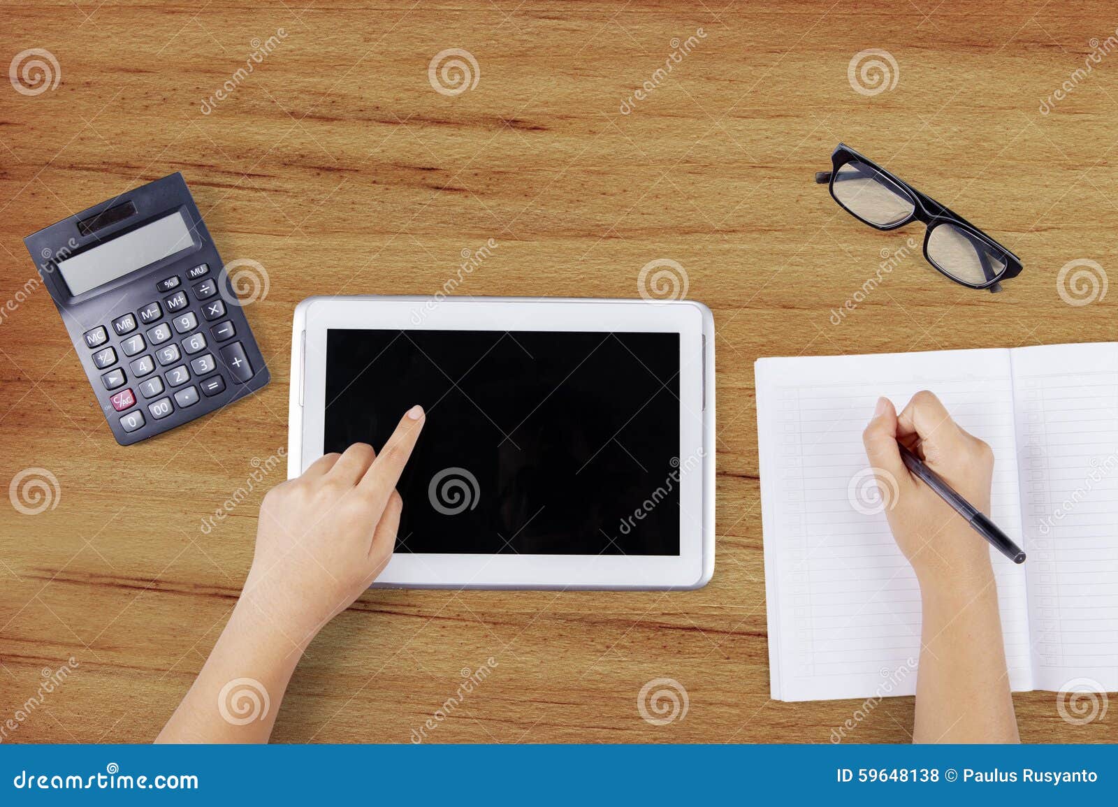 Student Hand Using Tablet while Writing on Book Stock Photo - Image of ...