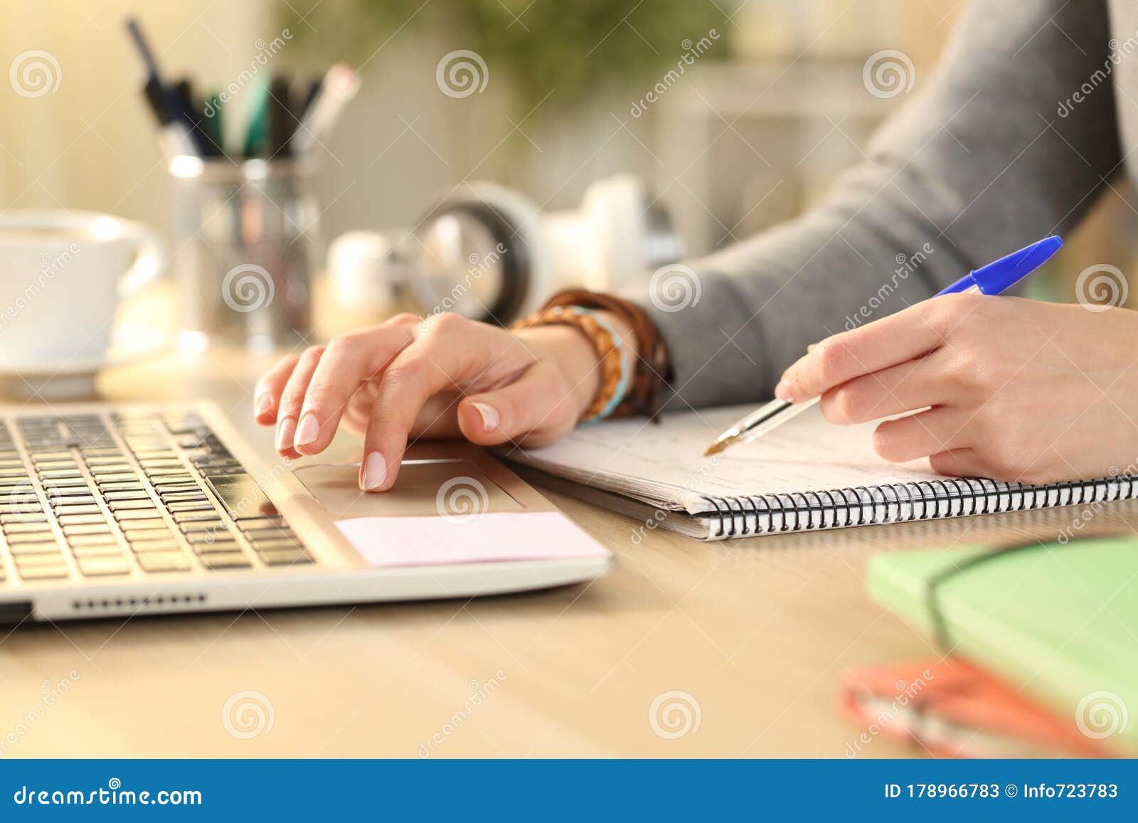Student Hands Comparing Notes on Notebook with Laptop Stock Image ...