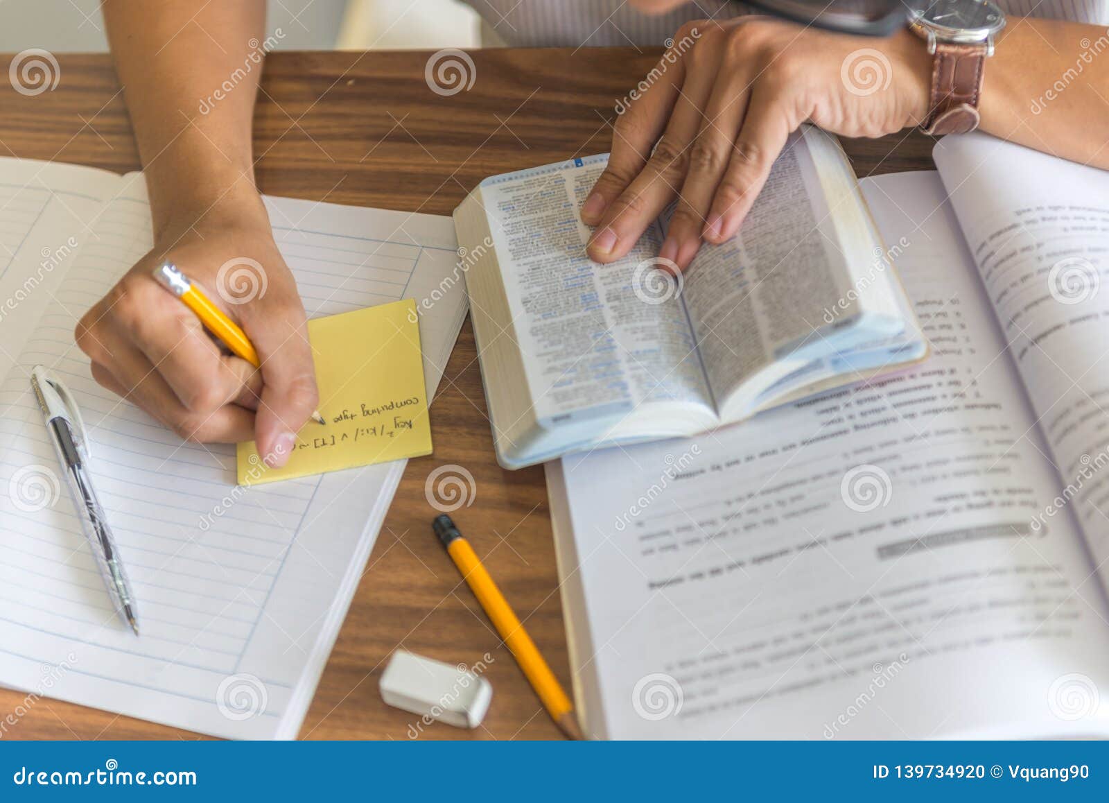 Student Hands Taking Note and Looking Up Dictionary Stock Photo - Image ...