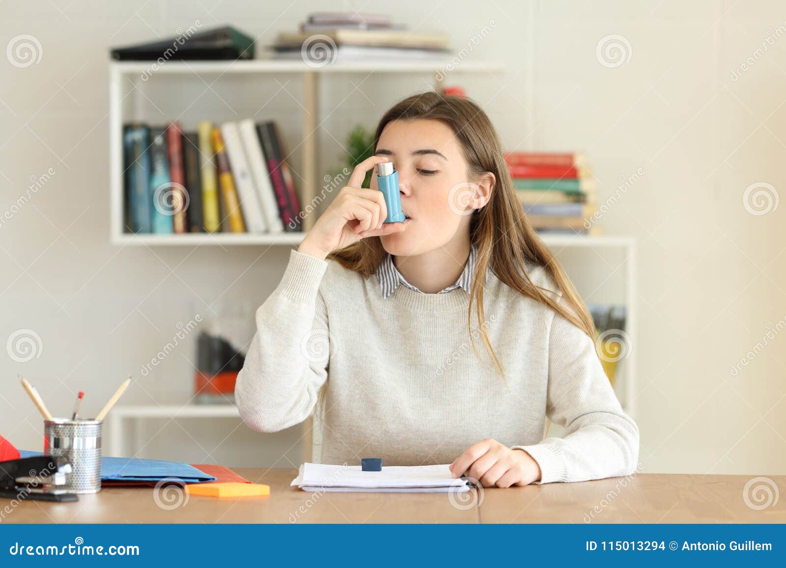 Student Using an Asthma Inhaler at Home Stock Photo - Image of high ...
