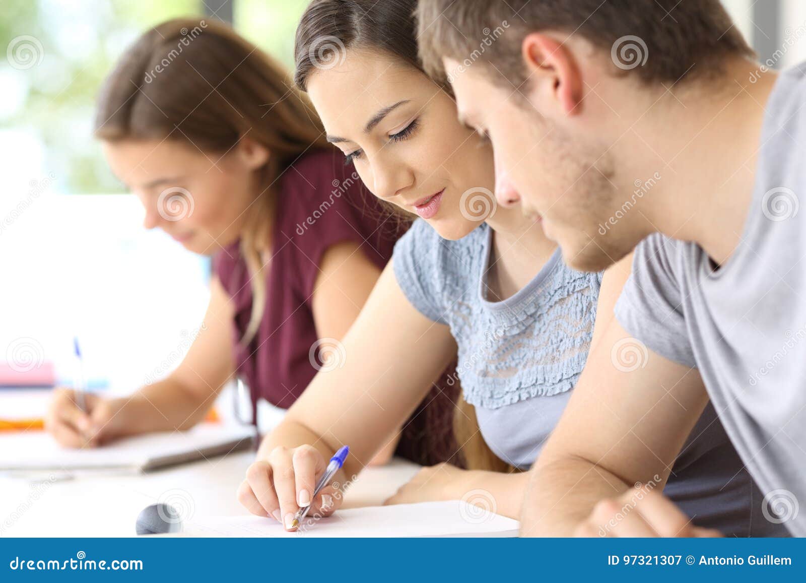 Student Helping To a Classmate at Classroom Stock Image - Image of ...
