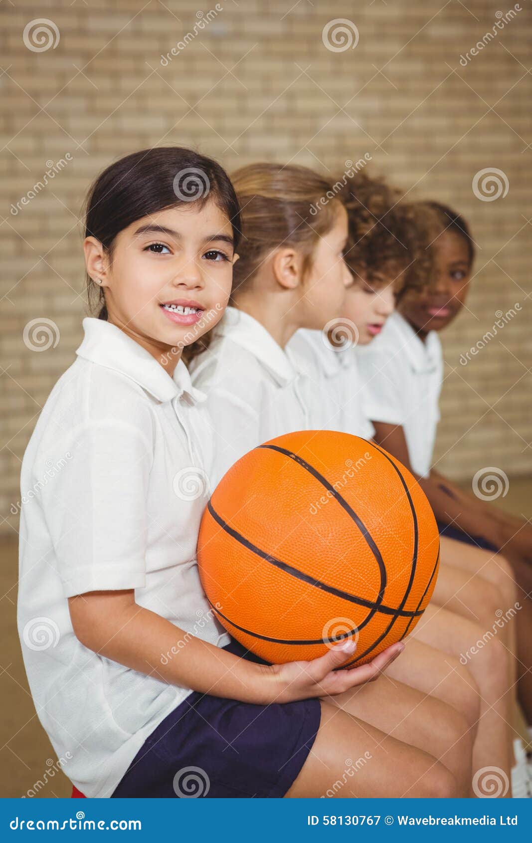 Student Holding Basketball with Fellow Players Stock Image - Image of ...