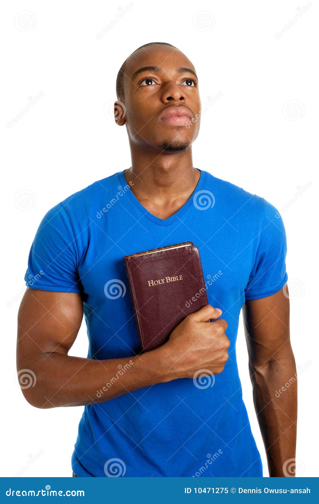 Student Holding a Bible Looking Up Stock Image - Image of looking, male ...