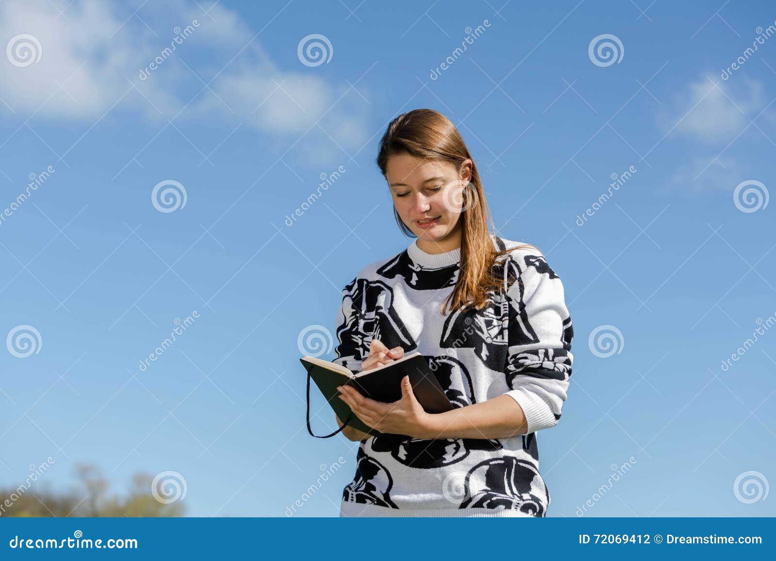 Student Holding a Book in Hand Stock Photo - Image of nature, girl ...