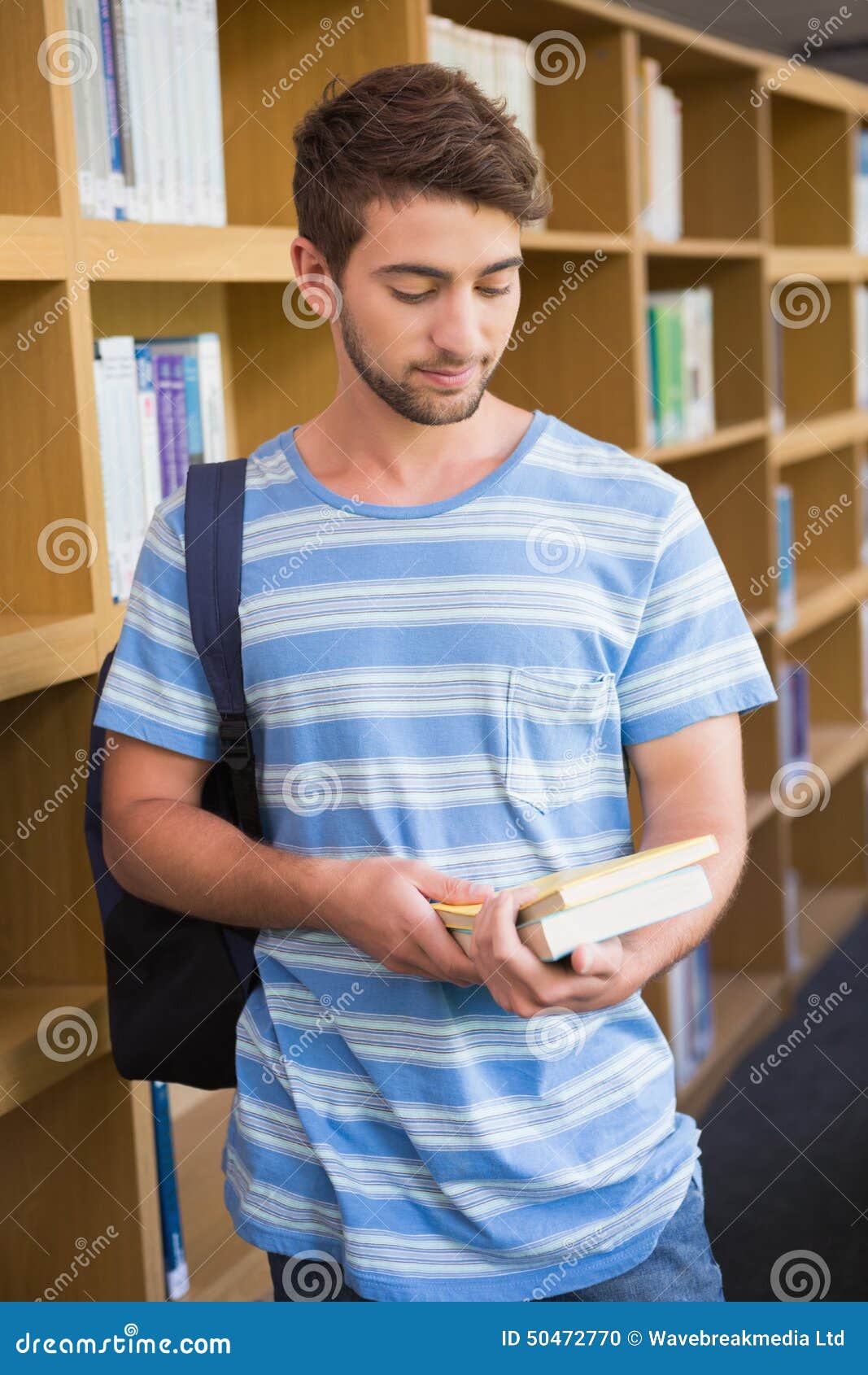 Student Holding Books in Library Stock Photo - Image of book, bookshelf ...
