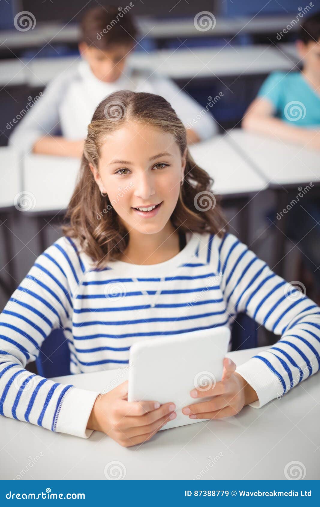 Student Holding Digital Tablet in Classroom Stock Image - Image of ...
