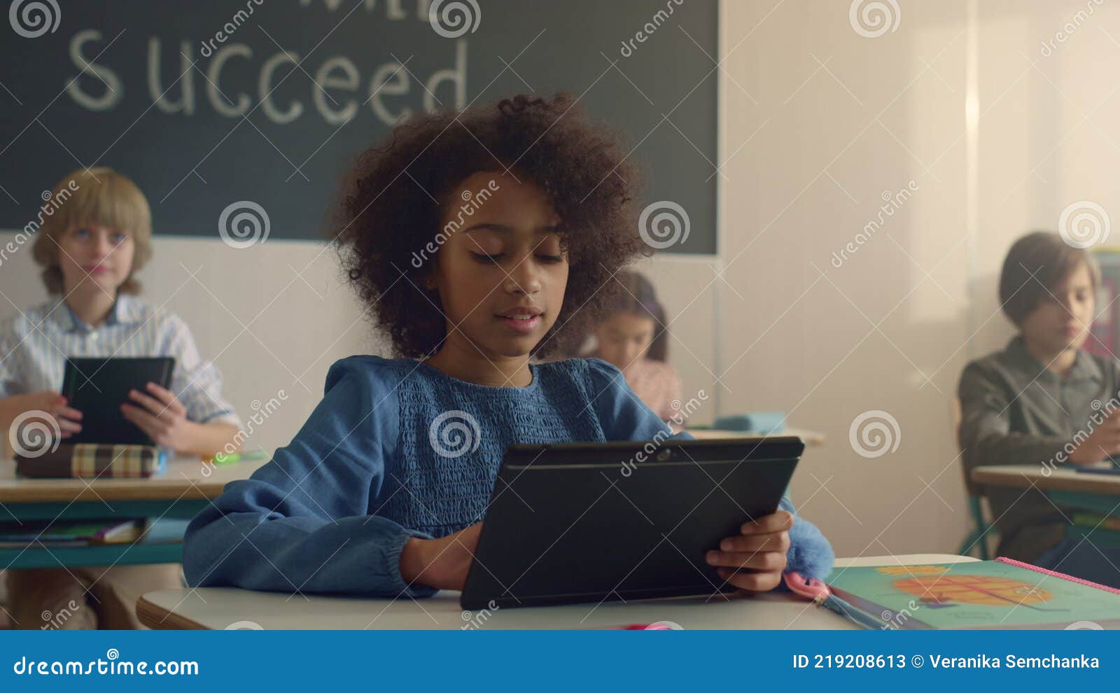 Student Holding Digital Tablet in Classroom. Schoolgirl Using Tablet ...