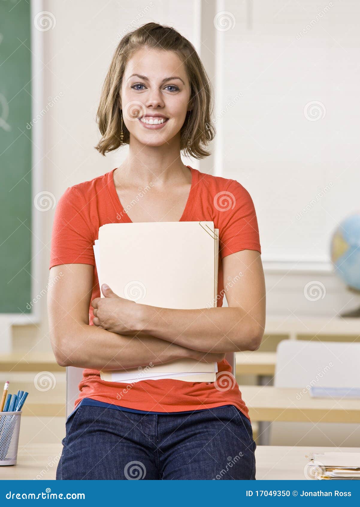 Student Holding File Folder Stock Photo - Image of western, smiling ...