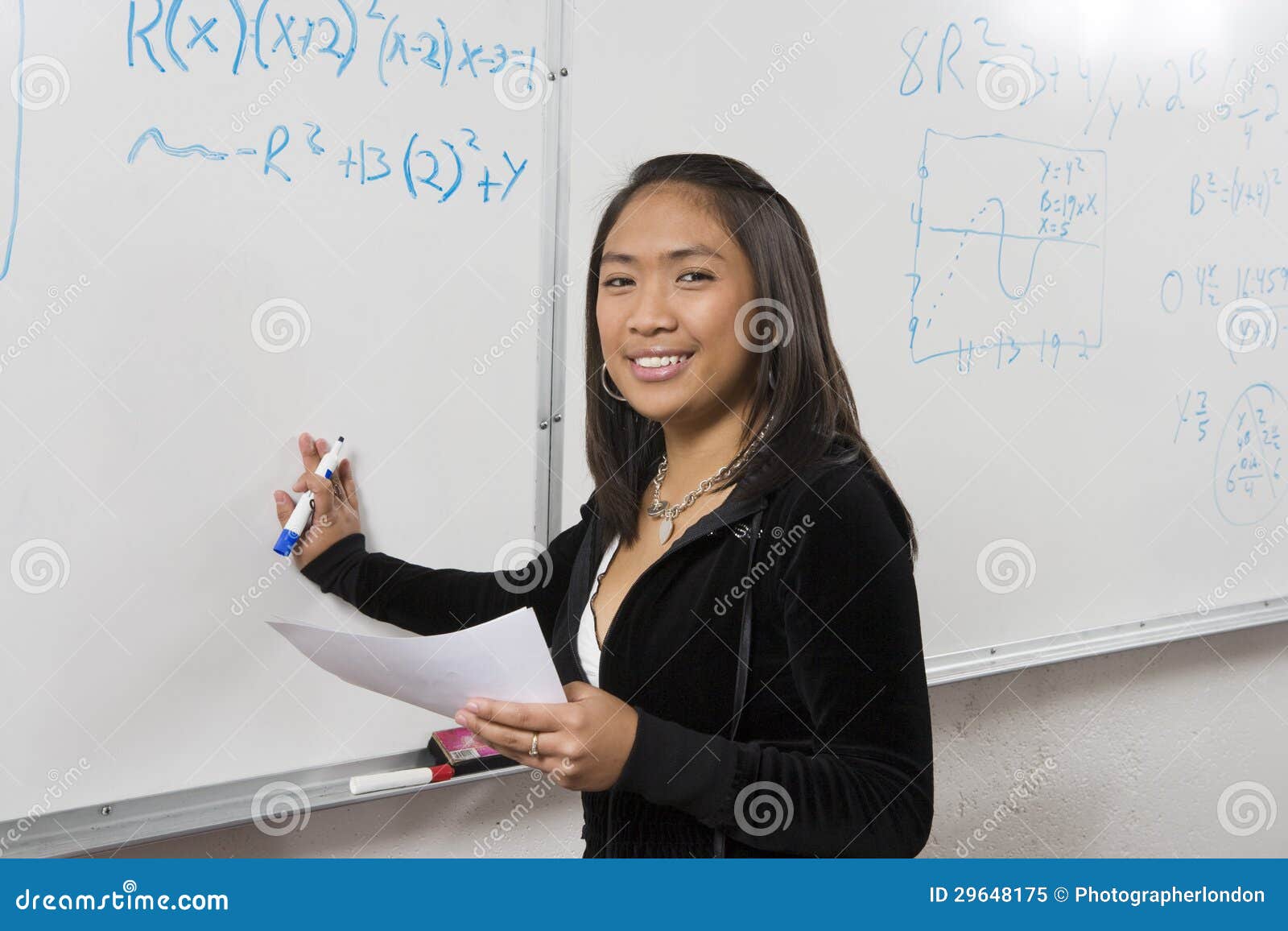 Student Holding Marker and Paper in Front of Whiteboard Stock Image ...