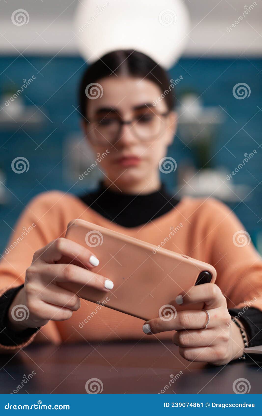 Student Holding Smartphone and Looking at the Screen. Stock Image ...