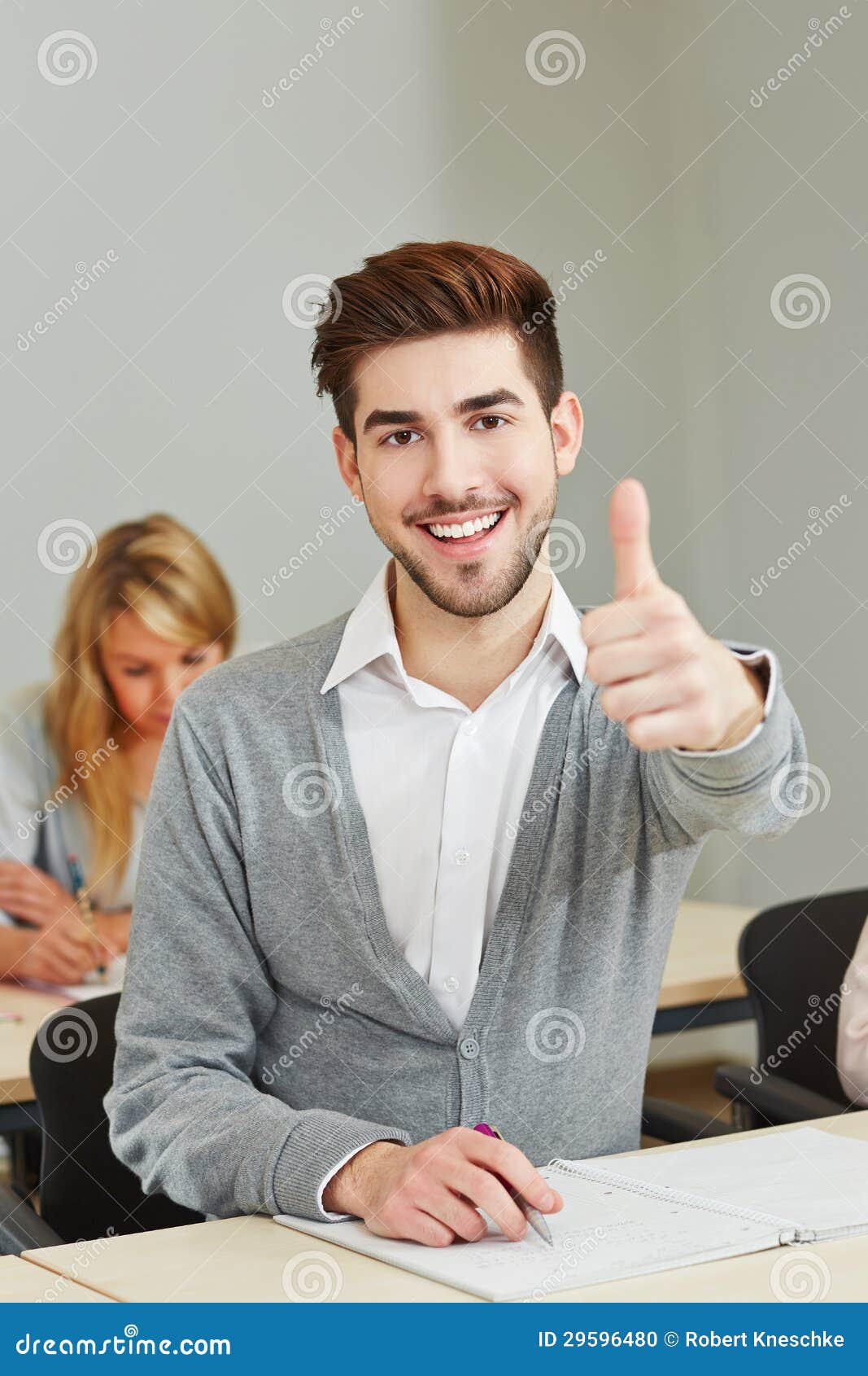 Student holding thumbs up stock photo. Image of success - 29596480