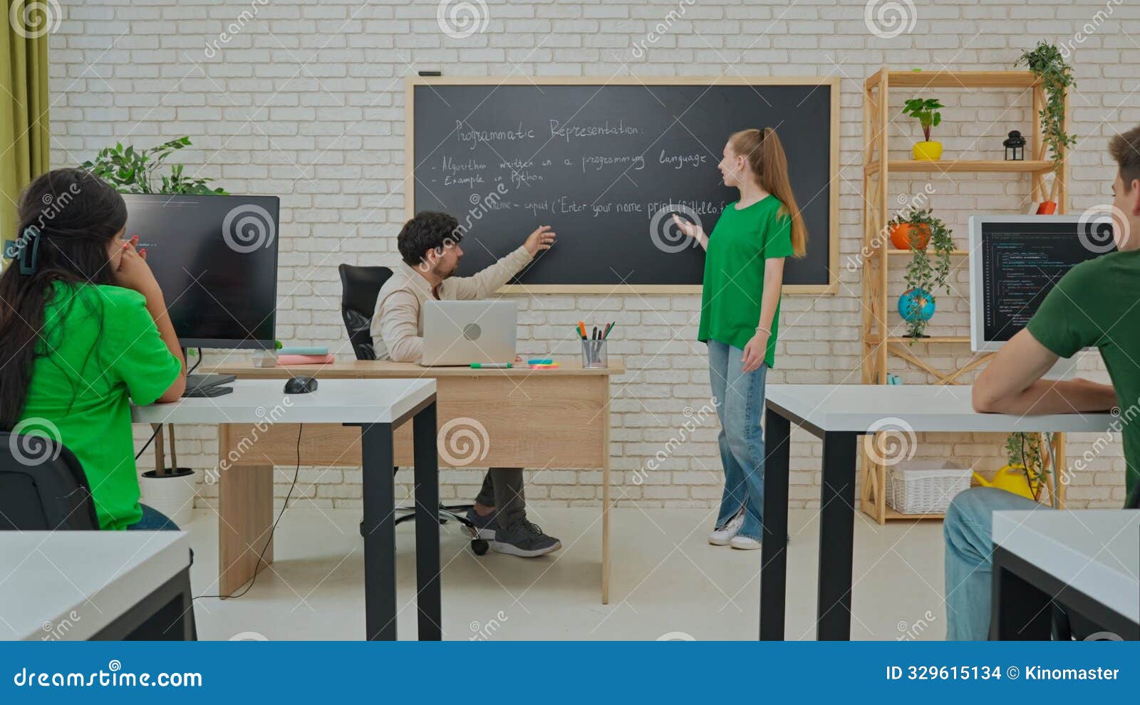 Student and Instructor Discuss Python Code in Modern Classroom Stock ...