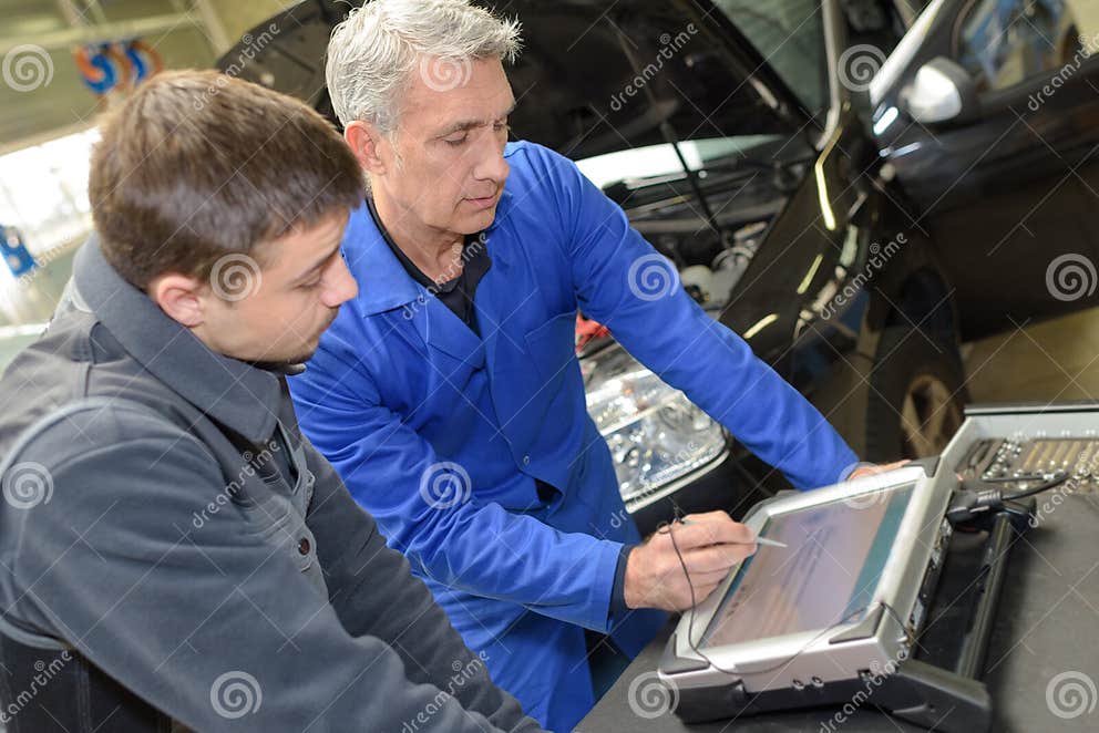 Student with Instructor Repairing Car during Apprenticeship Stock Photo ...