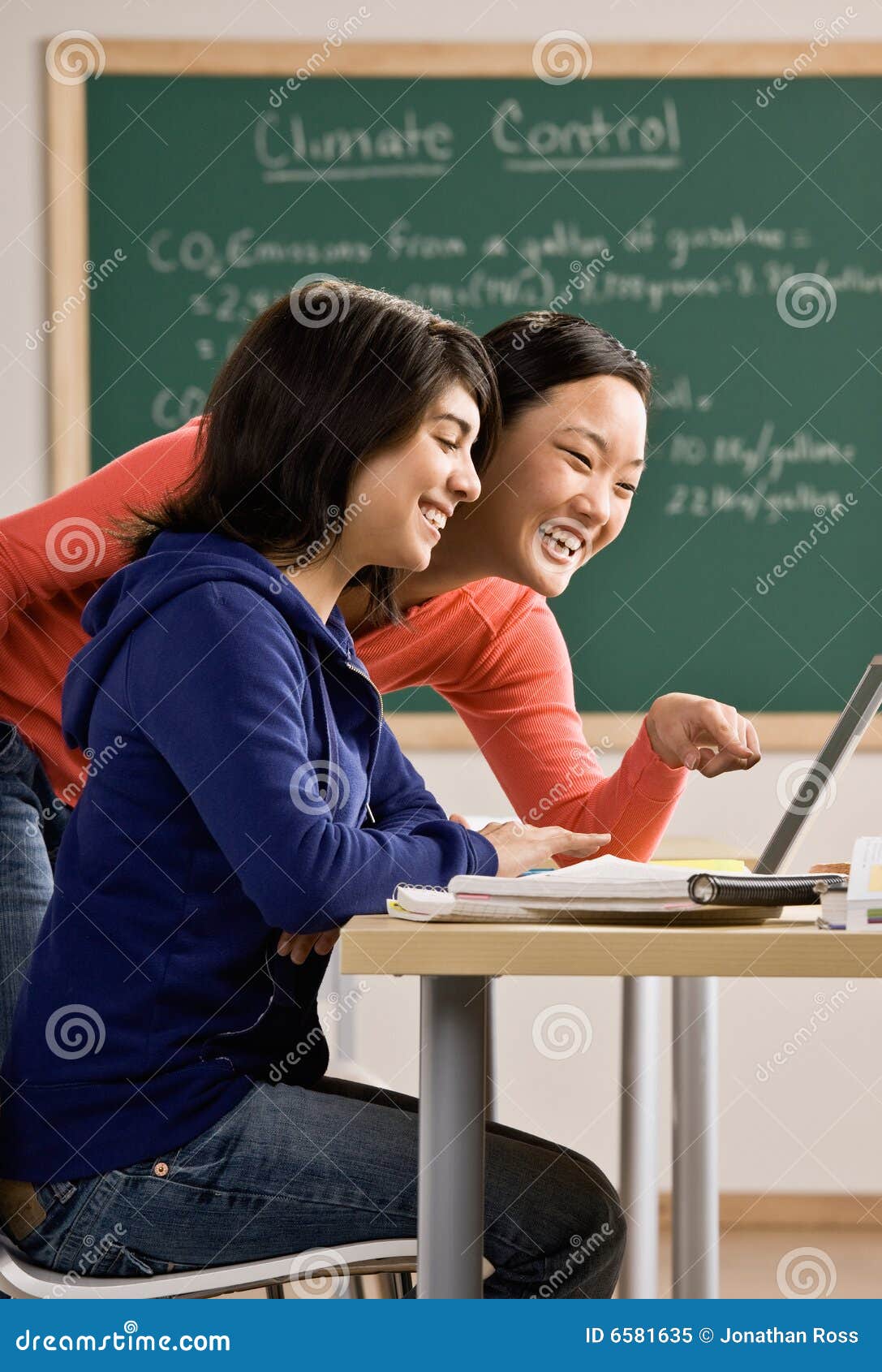 Student with Laptop Doing Homework with Friend Stock Image - Image of ...