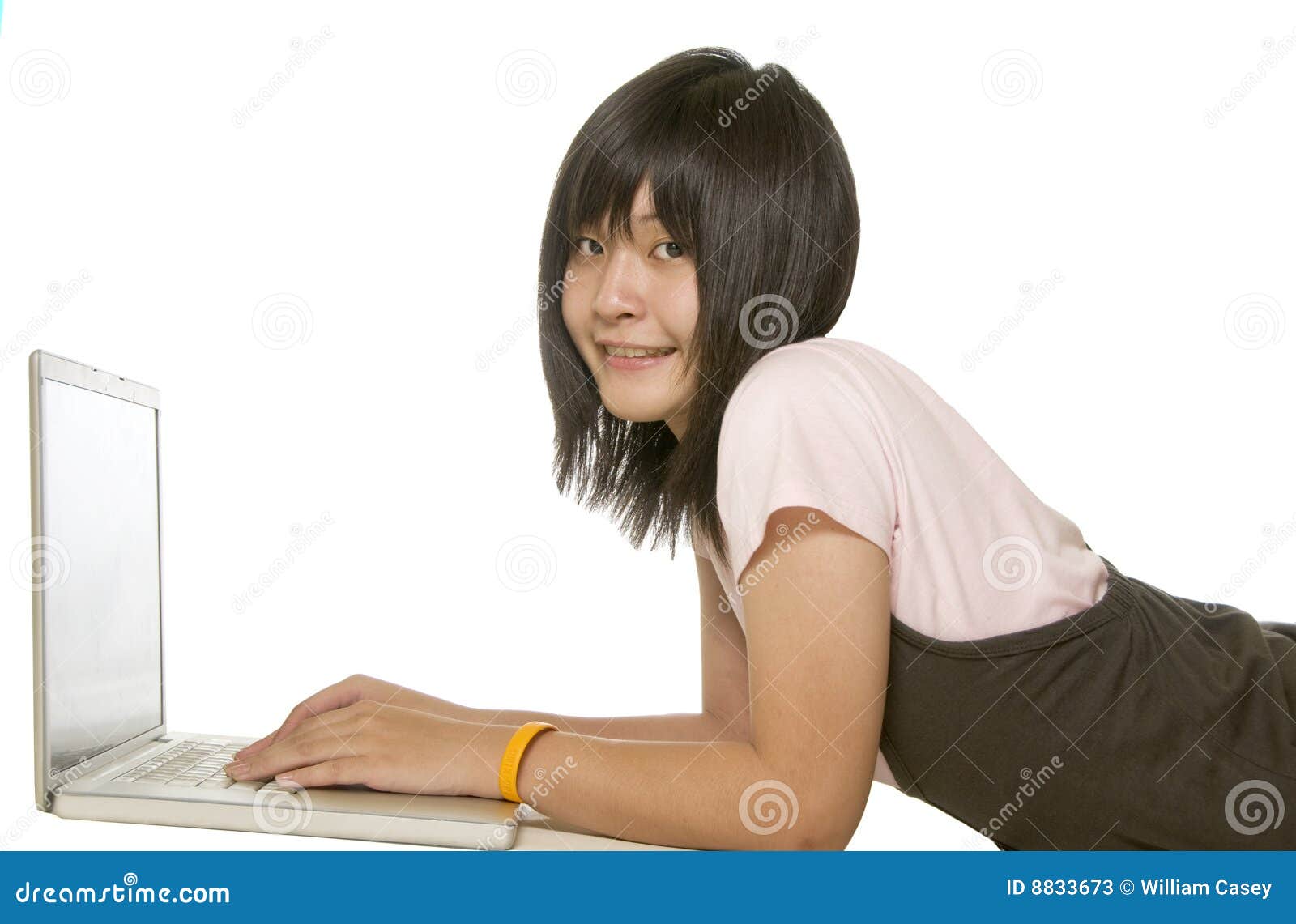 Student Laying Down and Using Computer Stock Image - Image of oriental ...