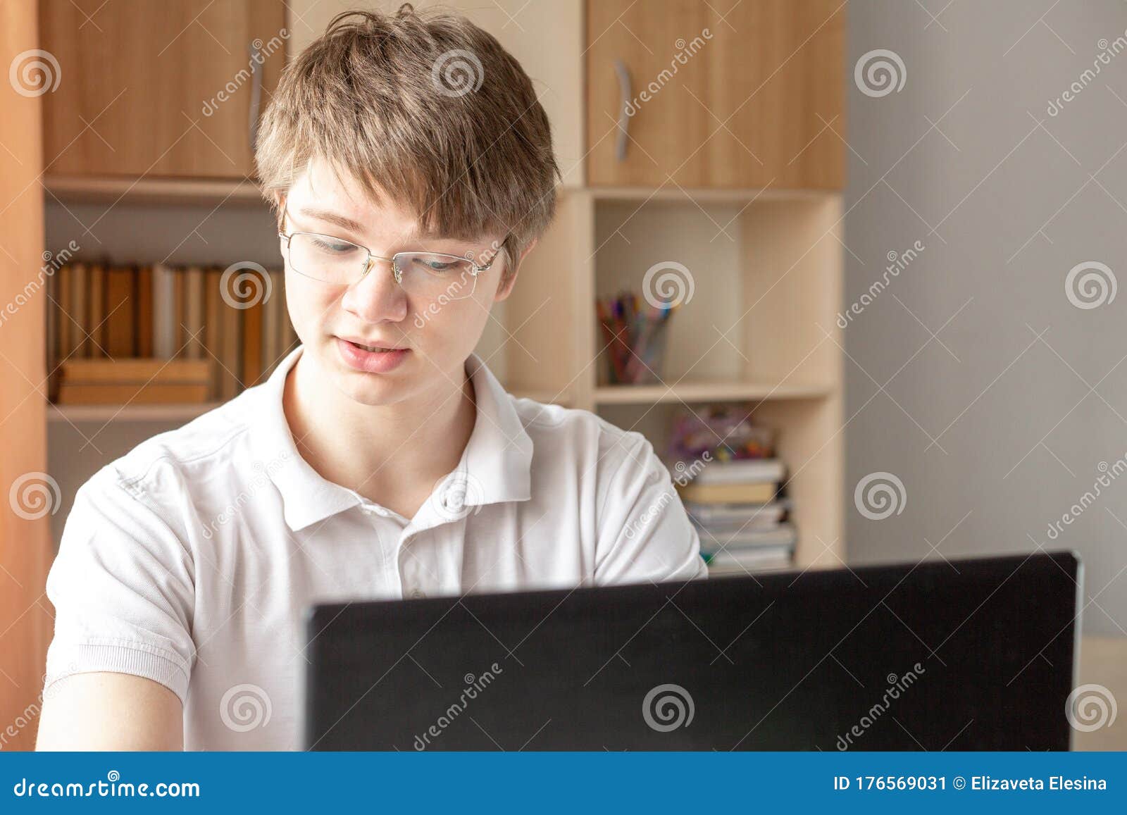 Student Learning at Home Using Laptop. Home School Online Education ...