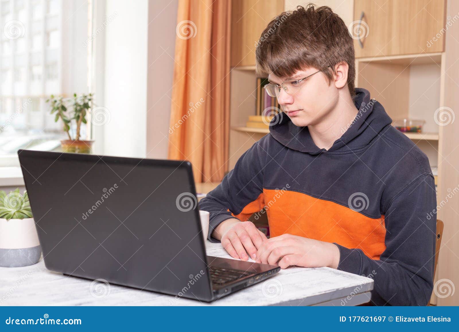 Student Learning at Home Using Laptop. Home School, Online Education ...