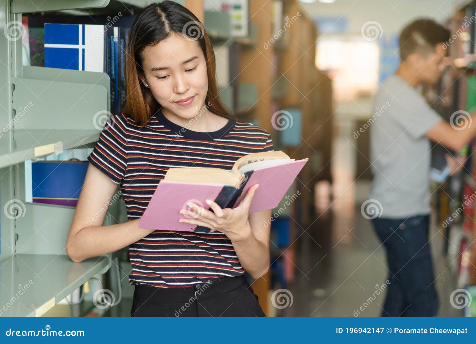 Student Learning in Library. Young Read Book in Library for Doing ...