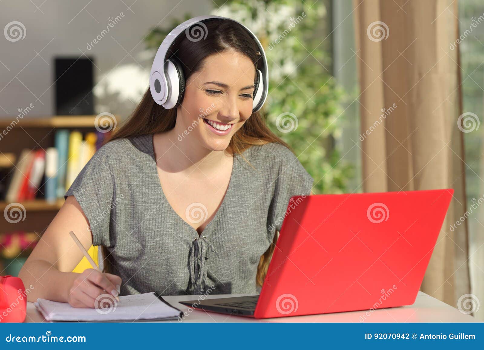 Student Learning on Line with a Laptop and Headphones Stock Photo ...