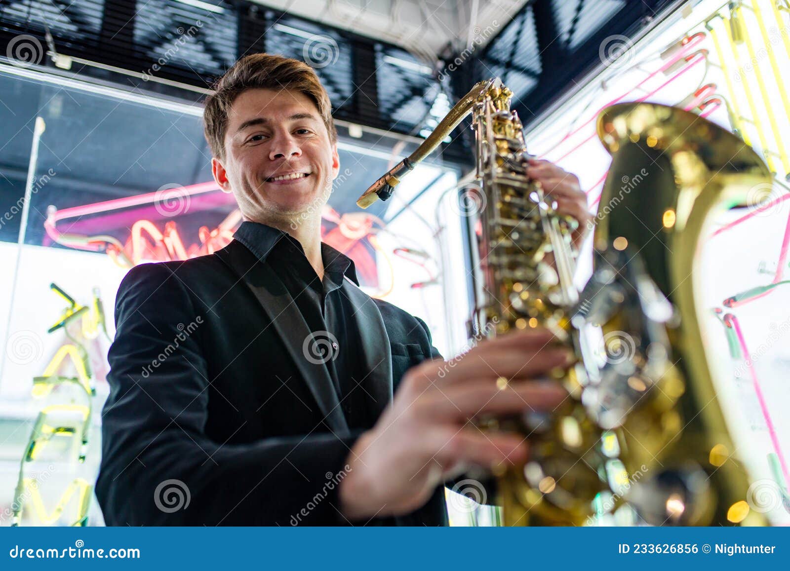 Student Learning To Play on Saxophone in the Room Stock Photo - Image ...