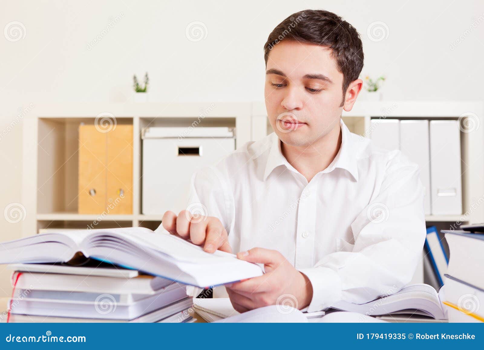 Student learns at the desk stock image. Image of book - 179419335