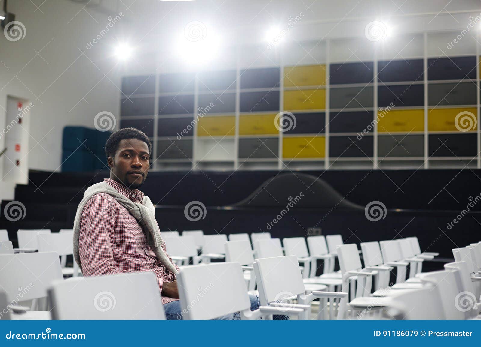 Student in lecture hall stock image. Image of education - 91186079