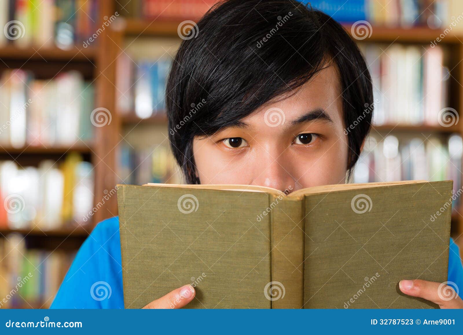 Student in Library Reading Book Stock Image - Image of homework, male ...
