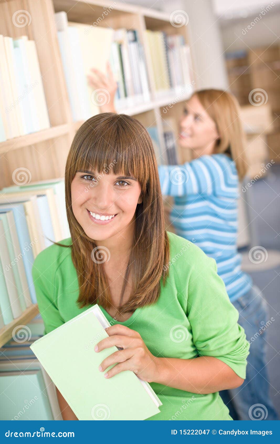 Student in Library - Two Woman Hold Book Stock Image - Image of library ...
