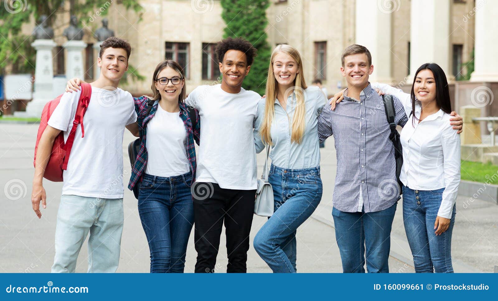 Classmates Posing in Front of University and Smiling To Camera Stock ...