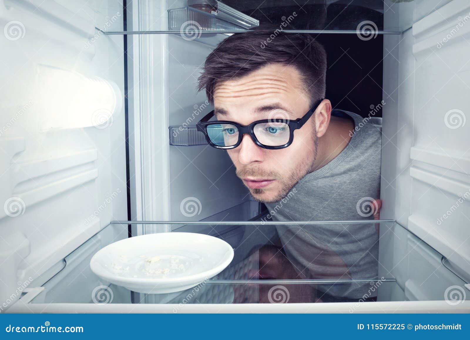 Looking In Empty Refrigerator