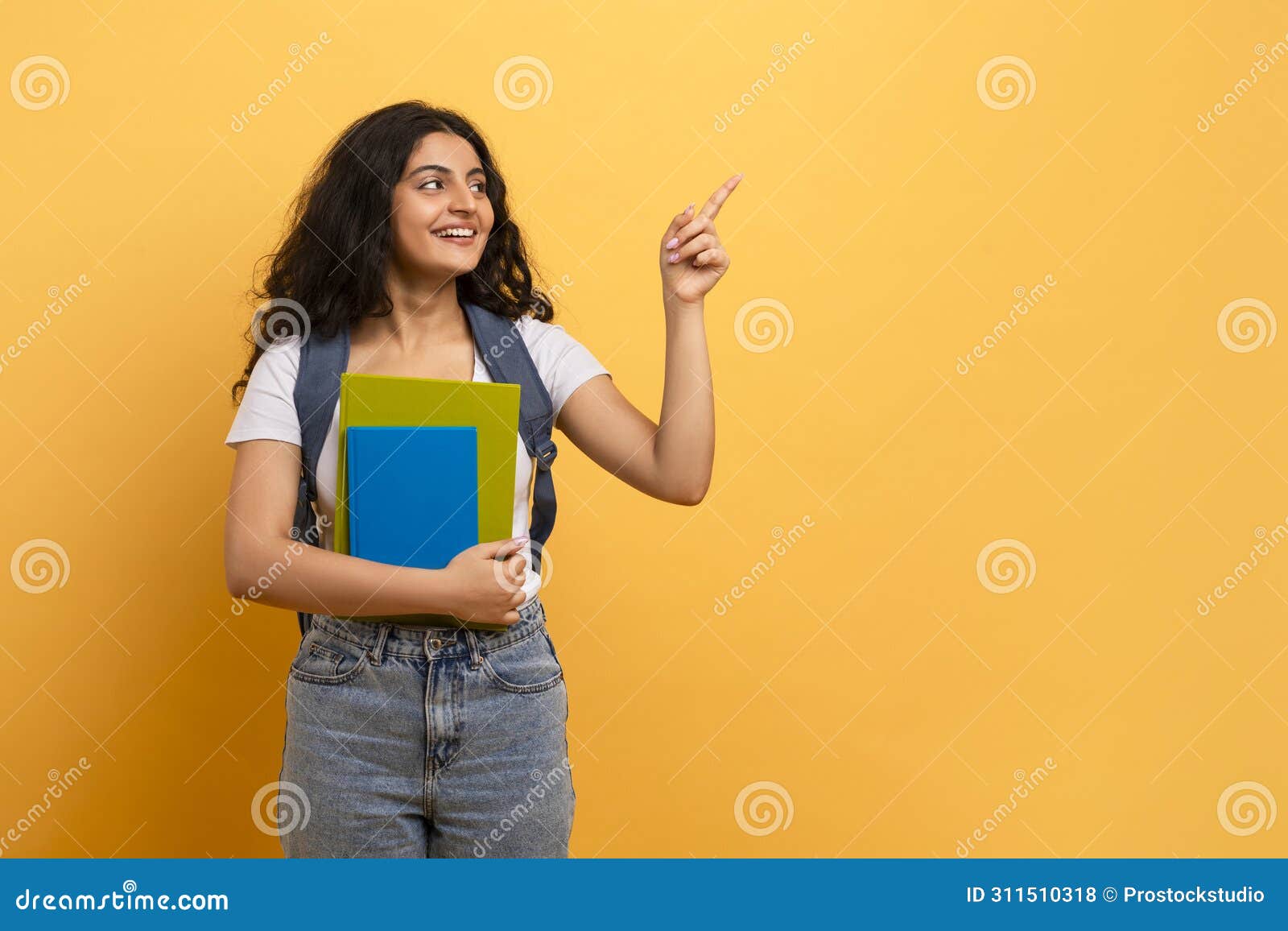 Student Looking and Pointing Upwards Stock Photo - Image of studio ...