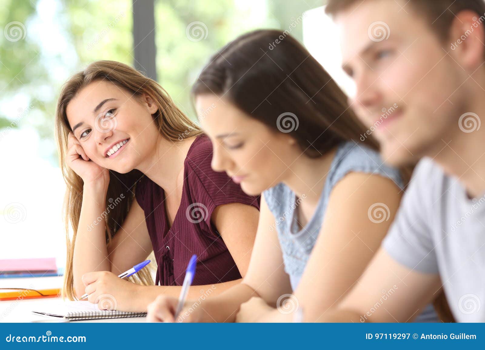 Student in Love Looking at a Classmate Stock Image - Image of candid ...