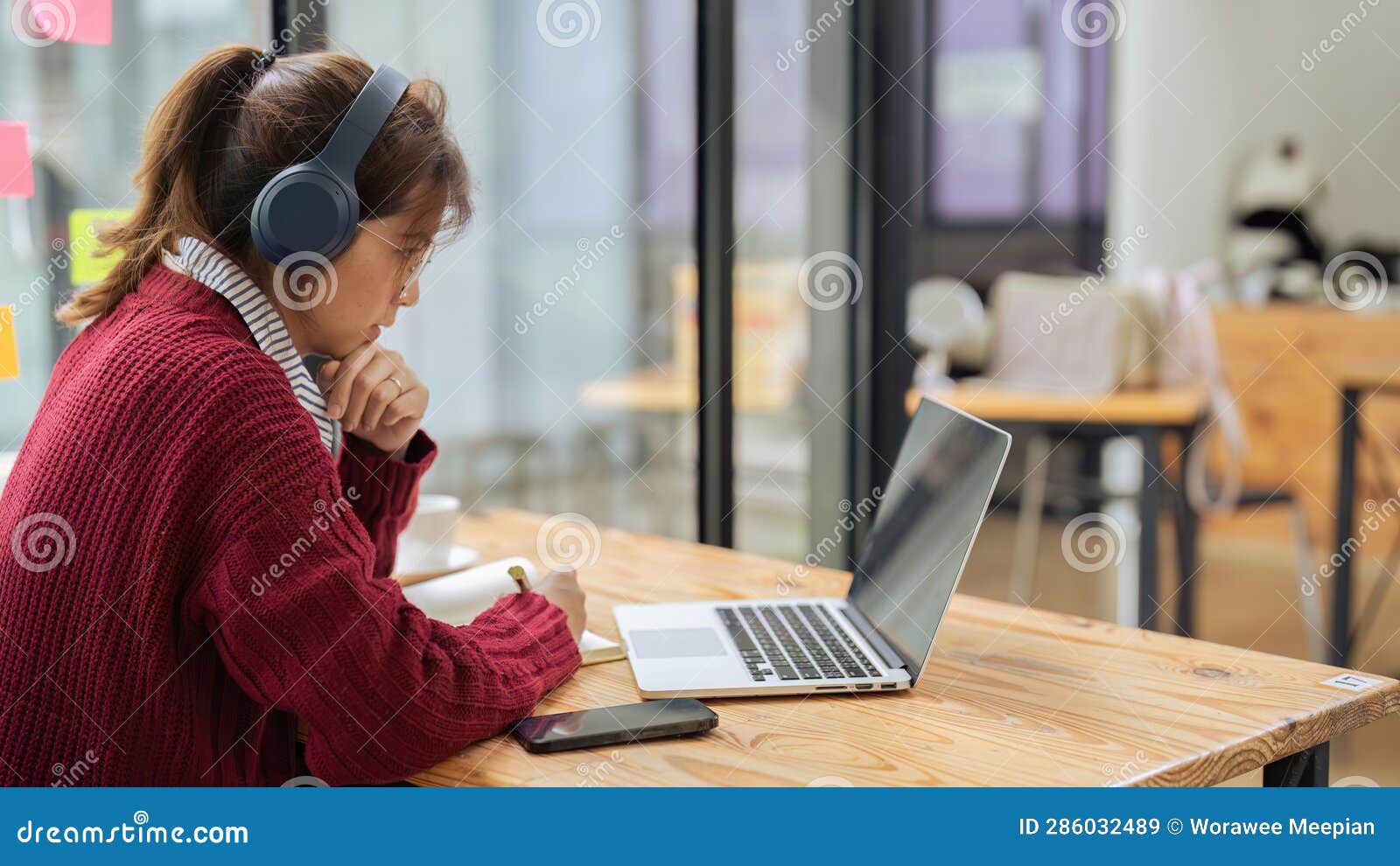 Student Making Notes during Online Lesson at Co Working Space Stock ...