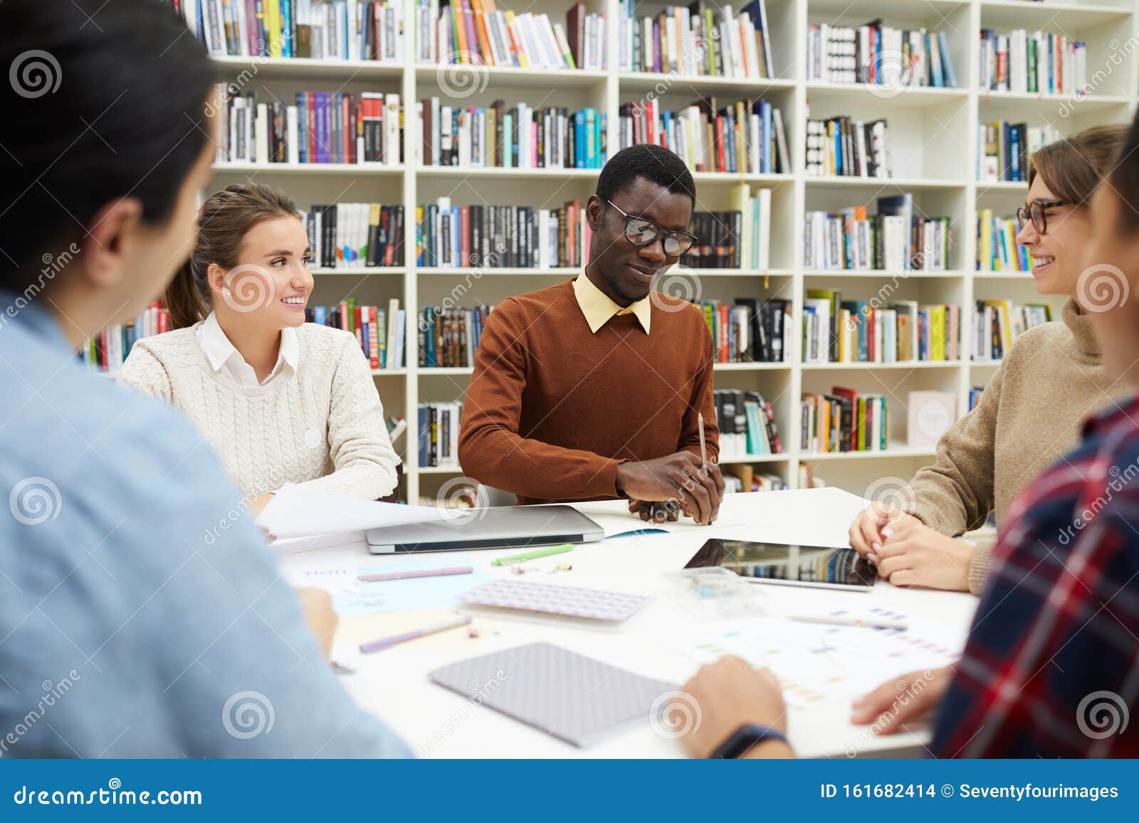 Student Meeting in Library stock photo. Image of laptop - 161682414