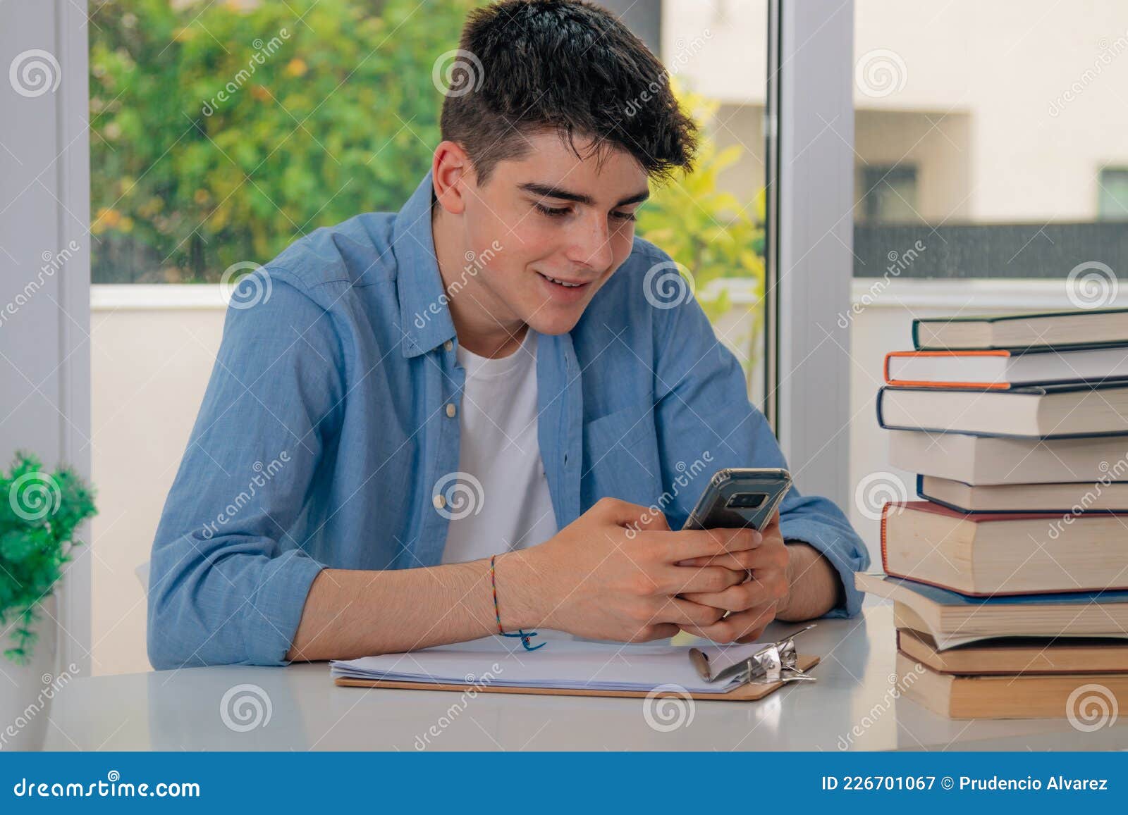Student with mobile phone stock image. Image of adolescence - 226701067