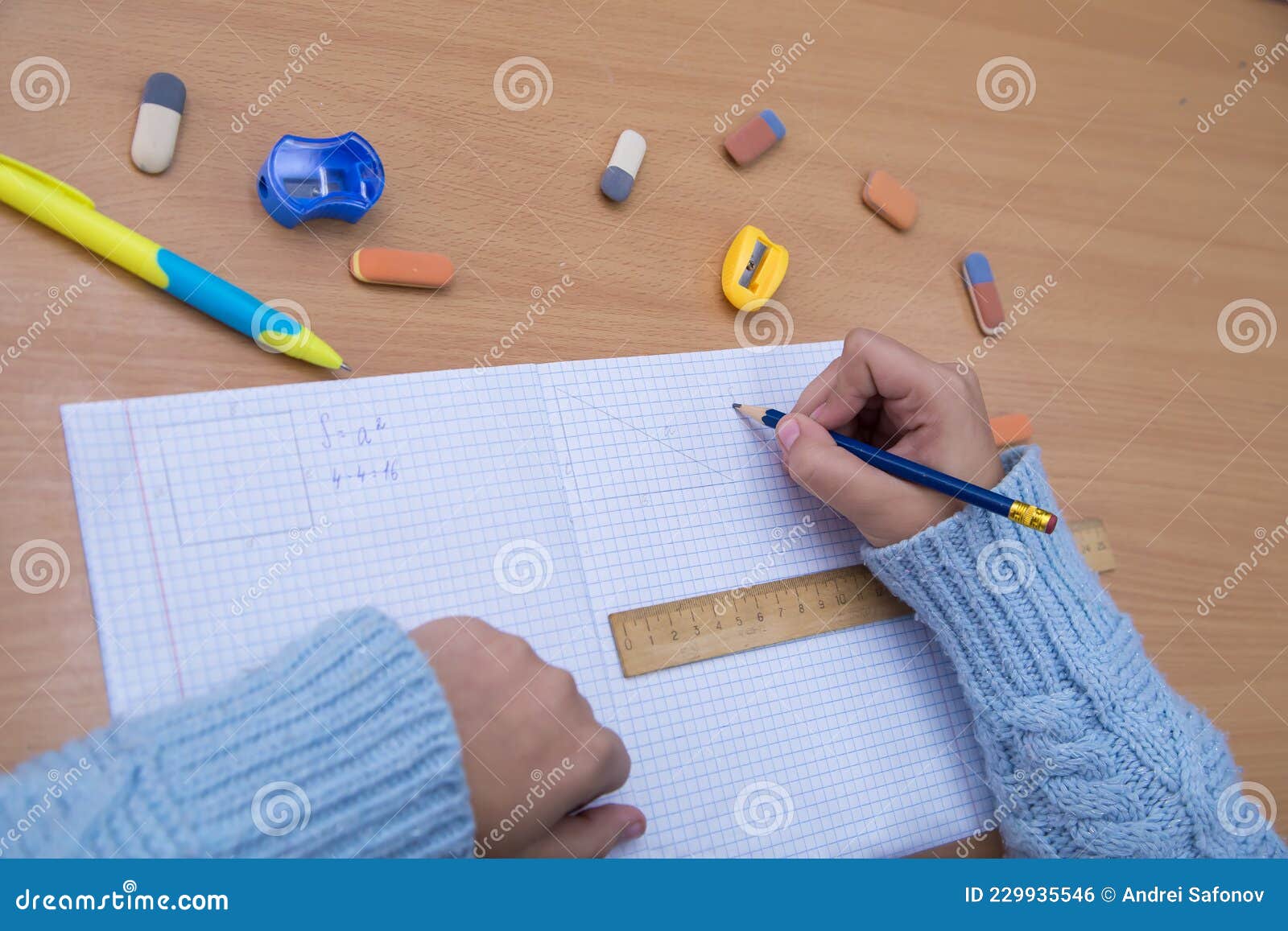 The Student in the Notebook Signs the Notation with a Pencil. Stock ...