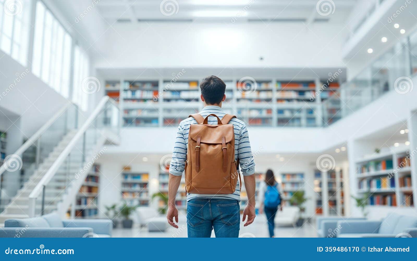 Student Observing A Modern Library Interior With Bookshelves And Soft ...