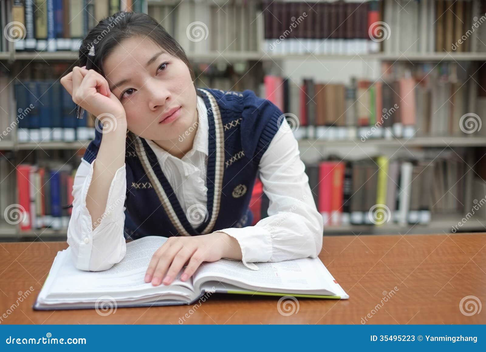 Student with Open Textbook Deep in Thought Stock Image - Image of girl ...