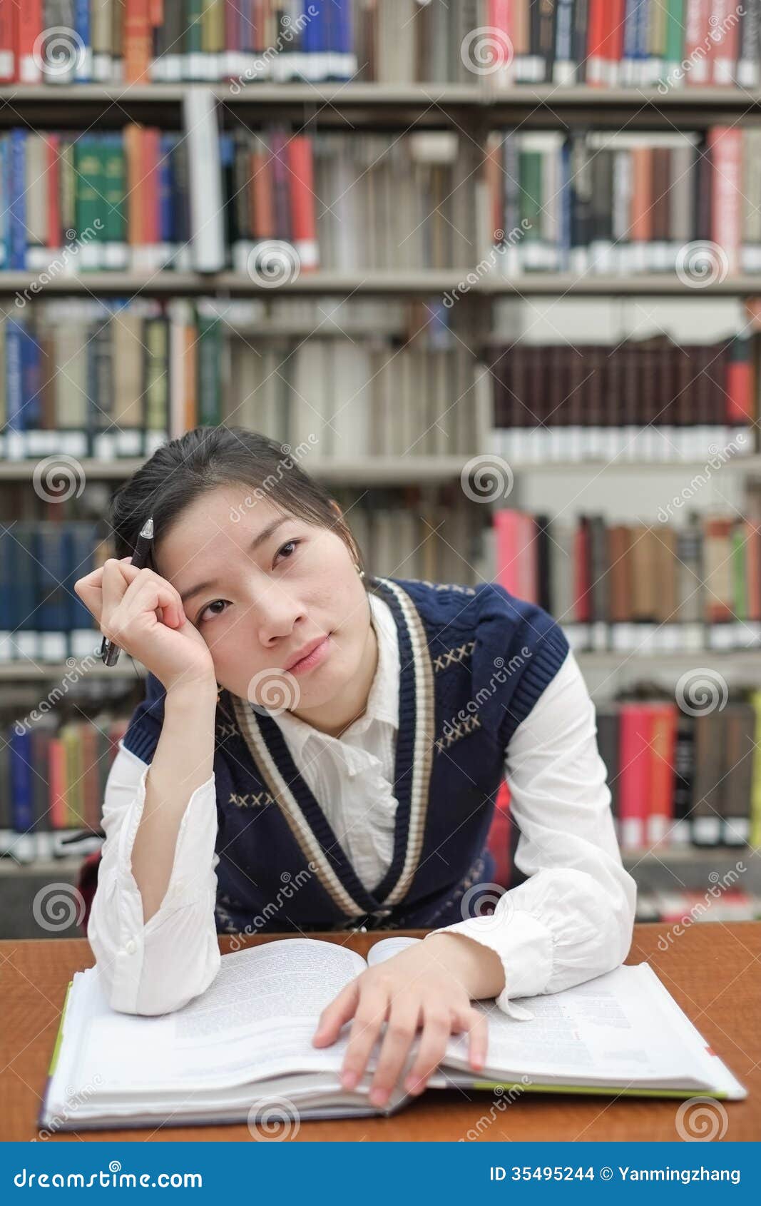 Student with Open Textbook Deep in Thought Stock Photo - Image of ...