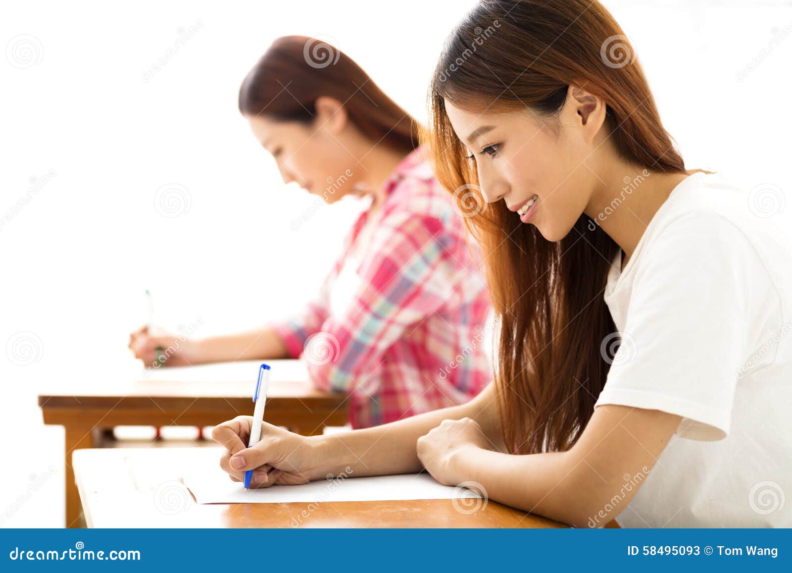 Student with Others Writing Notes in the Classroom Stock Image - Image ...